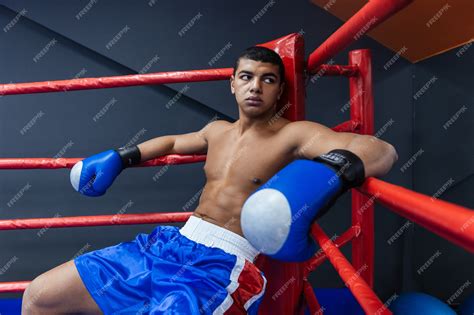 Premium Photo Male Boxer Sitting In The Corner Of The Boxing Ring