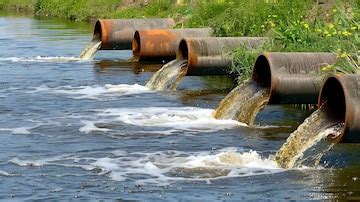 Premium Photo Industrial Wastewater Discharge From Multiple Pipes