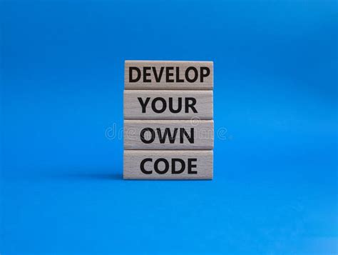 Develop Your Own Code Symbol Concept Words Develop Your Own Code On Wooden Blocks Beautiful
