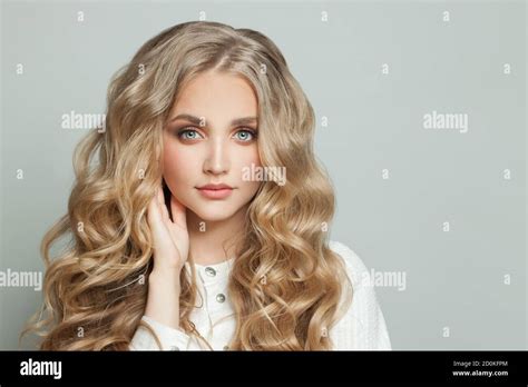 Pretty Young Fashion Model Woman With Long Healthy Curly Hairstyle