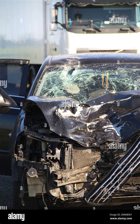 Broken Engine Compartment And Mangled Car Engine After A Head On Collision At High Speed Stock