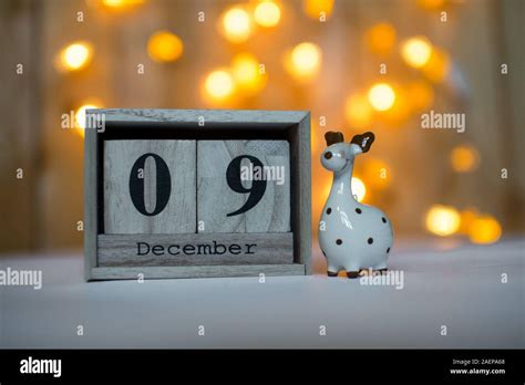 Cube Wooden Calendar Showing Date On 9th December With Ceramic Reindeer
