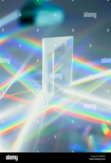 White Light Being Refracted As It Passes Through A Triangular Prism To