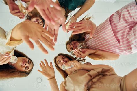 View From Below Group Of Happy Women That Is At A Bachelorette Party