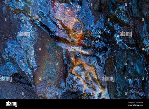 Close Up Of Biofilm Bacteria Proliferation On Wet Iron Rich Rocks On