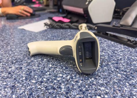 Premium Photo Barcode Scanner In Hand Scanning Product In Store Modern Technology Concept