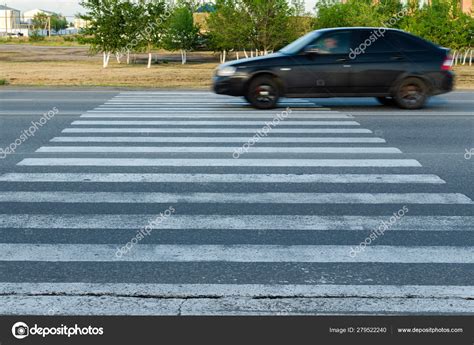 Car At High Speed Passes Through A Pedestrian Zebra — Stock Editorial