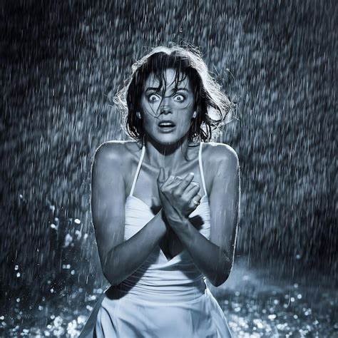 Surprised Freezing Woman Trembles During Windy Rainy Weather Premium