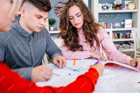Free Photo Students Making Assignment Together In Library
