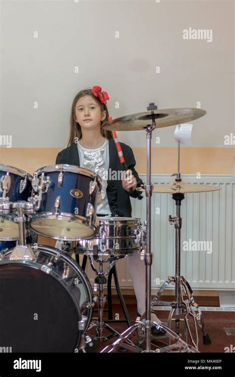 Young Caucasian Teenage Girl Plays The Drums Girl Playing The Drum Set