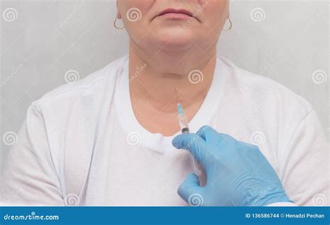 Doctor Makes A Patient Patient A Thyroid Biopsy On Suspicion Of Oncology Thyroid Node Close Up