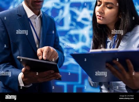 Developer And Colleague Analyzing Complex Ai Brain Models On Tablet It Specialist And Coworker