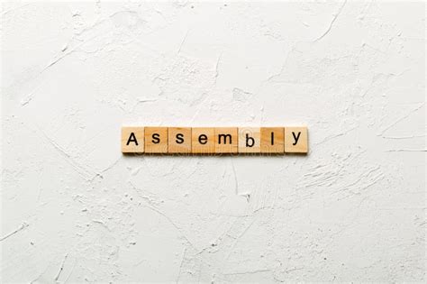 Assembly Word Written On Wood Block Assembly Text On Cement Table For