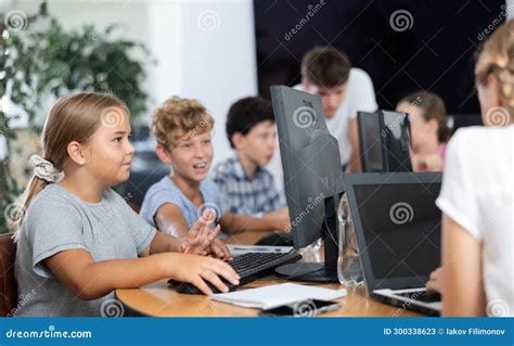 Computer Science Lesson In A School Computer Class A Girl And A Boy