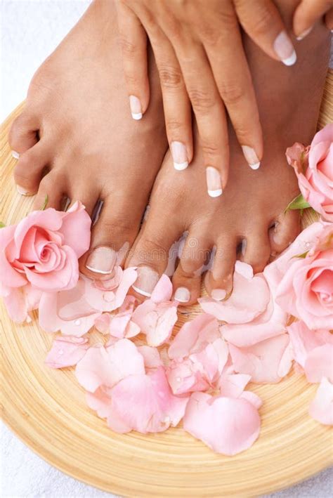 Beauty Treatment Skincare And Feet Of A Woman With Flowers For
