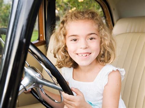 Premium Photo Portrait Of Smiling Girl Sitting In Car