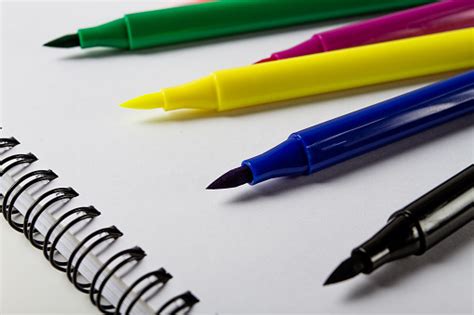 Watercolor Pens Brush Assortment On A Drawing Album Artists Desk Top