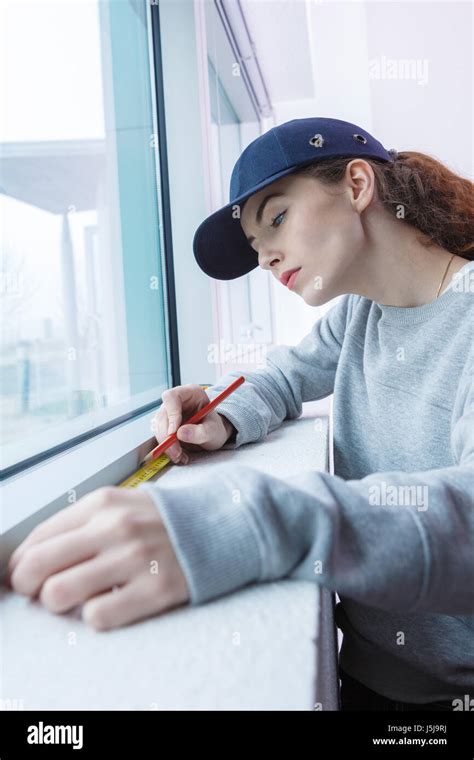 Woman Measuring Window Stock Photo Alamy