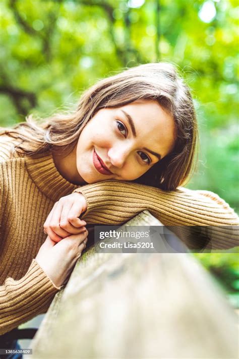 Candid Outdoor Headshot Of Beautiful Young Woman Enjoying The Outdoors