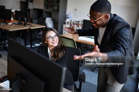 African Male Coding Teacher Impressed With Skills Of Female Intern