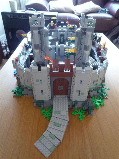 A Castle Made Out Of Legos Sitting On Top Of A Table