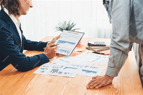 Premium Photo Analyst Team In Office Analyzing Financial Data