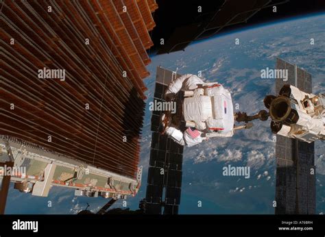 Astronaut Works On The Port Overhead Solar Array Wing On The
