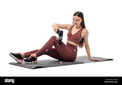 Woman Using Percussive Massager To Relieve Hip Muscles On White