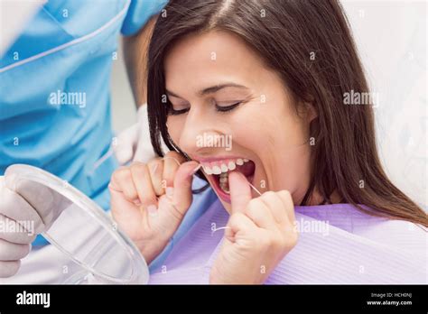 Female Patient Flossing Her Teeth Stock Photo Alamy