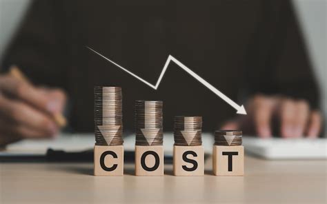 Premium Photo Cost Reduction Concept Cost Wording On Decreasing Coins