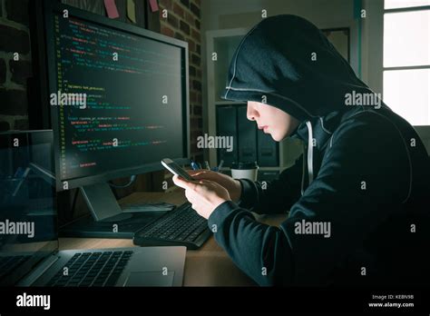 Pretty Beauty Girl Hacker Using Mobile Cell Phone Searching Online Information And Preparing To