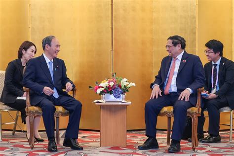 范明政会见日本前首相菅义伟和新加坡总理李显龙