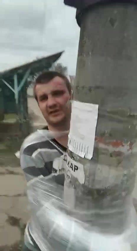 Looter Tied To Pole Stripped