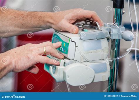 Anesthetist At A Operating Room Setting The Anesthesia Machine Stock