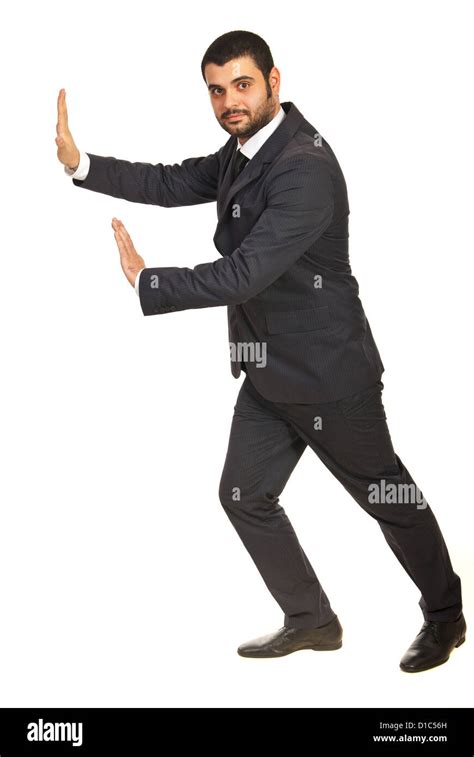 Business Man Pushing Something Imaginary Isolated On White Background Stock Photo Alamy