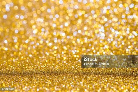 สีทองนามธรรมคริสต์มาสระยิบระยับพื้นหลังสดใสด้วยโบเก้แสงที่อยู่นอกโฟกัส ไฟแนวคิดพื้นหลั ภาพสต็อก