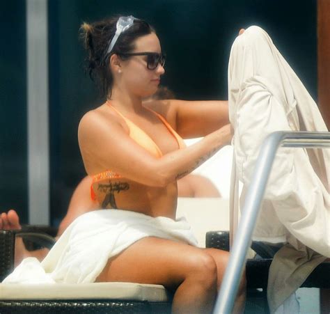 Lovely Two Piece Demi Lovato Relaxes In An Orange Bikini As She Soaks