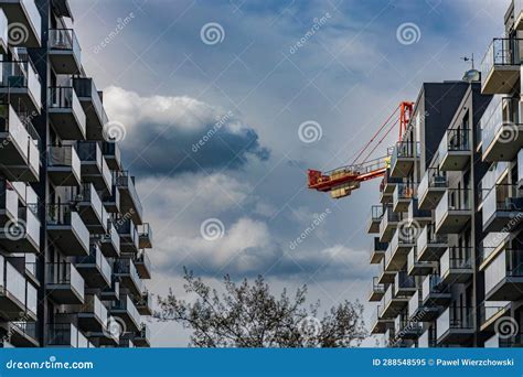 Long Brick Path Between Facades Of Two Modern Block Of Flats With