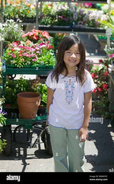 Girl At Plant Nursery Stock Photo Alamy