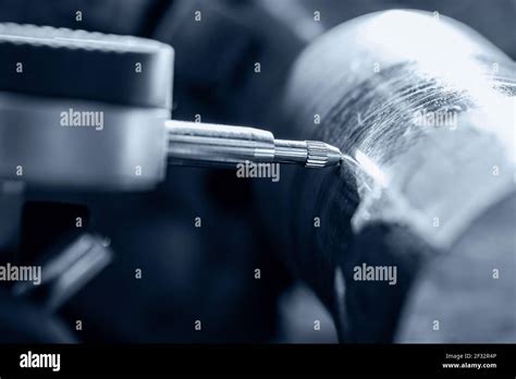 Process CNC Lathe Machine Cutting Metal Operator Measures Vibration Of Workpiece Steel Ingots