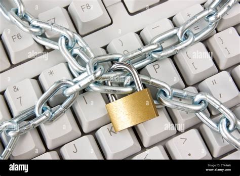 Computer Keyboard Secured With Chain And Padlock Stock Photo Alamy