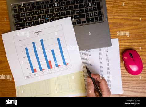 Performing Data Analysis Using Laptop Computer Spreadsheet Software And Graphical Output Stock