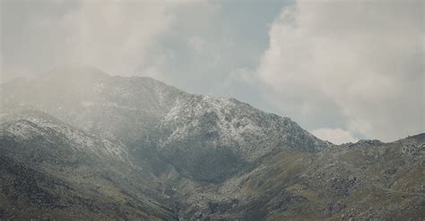 Landscape Of A Rocky Mountain Rage With Peaks Among Clouds · Free Stock
