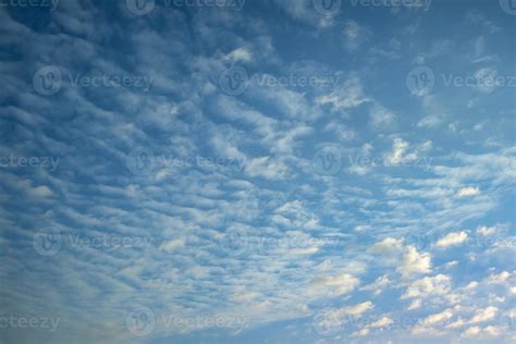 Dark Blue Sky Background With Tiny Stratus Cirrus Striped Clouds