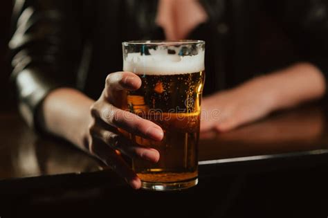Woman With Big Breasts Holds A Glass Of Beer Lager With Foam In Her Hand Stock Image Image Of