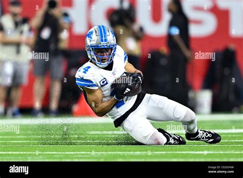 Detroit Lions Wide Receiver Amon Ra St Brown 14 Catches A Pass