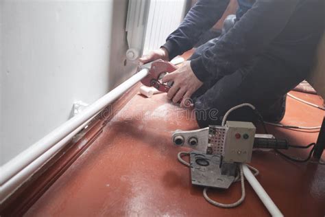 Man With Scissors Cutting Plastic Pipe Stock Image Image Of