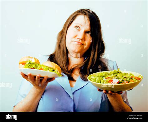 Fat White Woman Having Choice Between Hamburger And Salad Close Stock