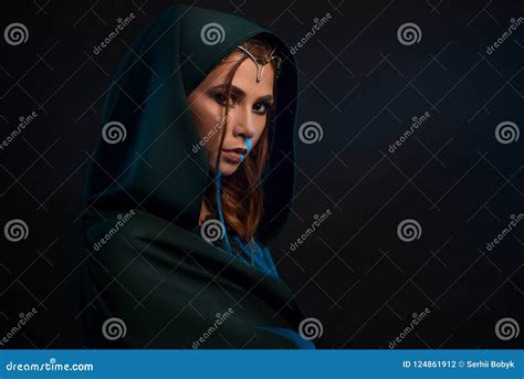 Beatiful Elf Princess Wearing Dark Green Cape Looking At Camera From