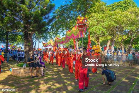 Lion And Dragon Dance During Nghinh Ong Celebration Group Of People